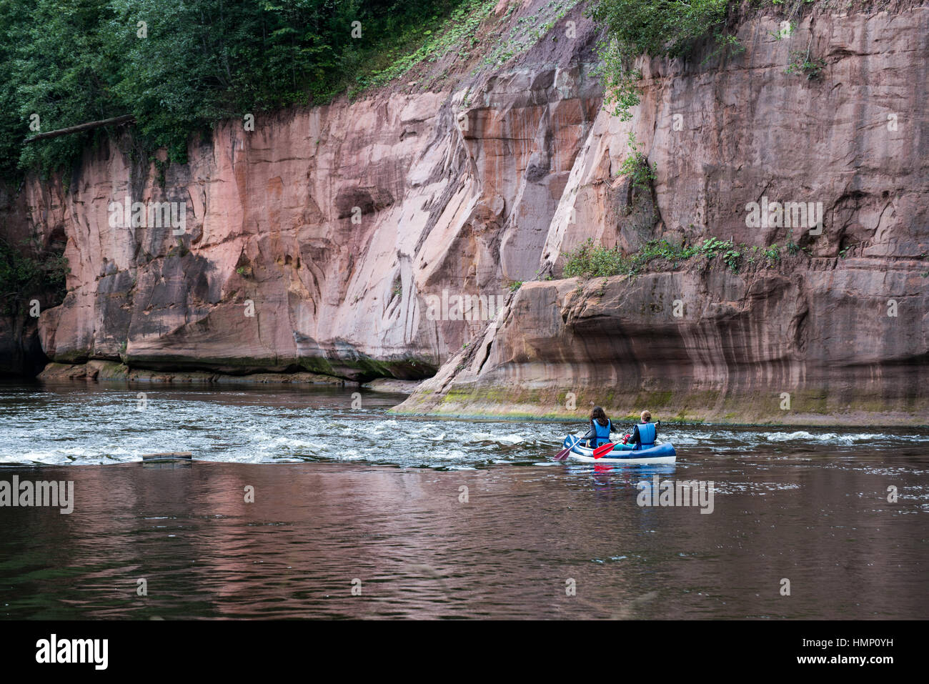 tourists enjoying water sports, kayaking in wild river - Sigulda ...