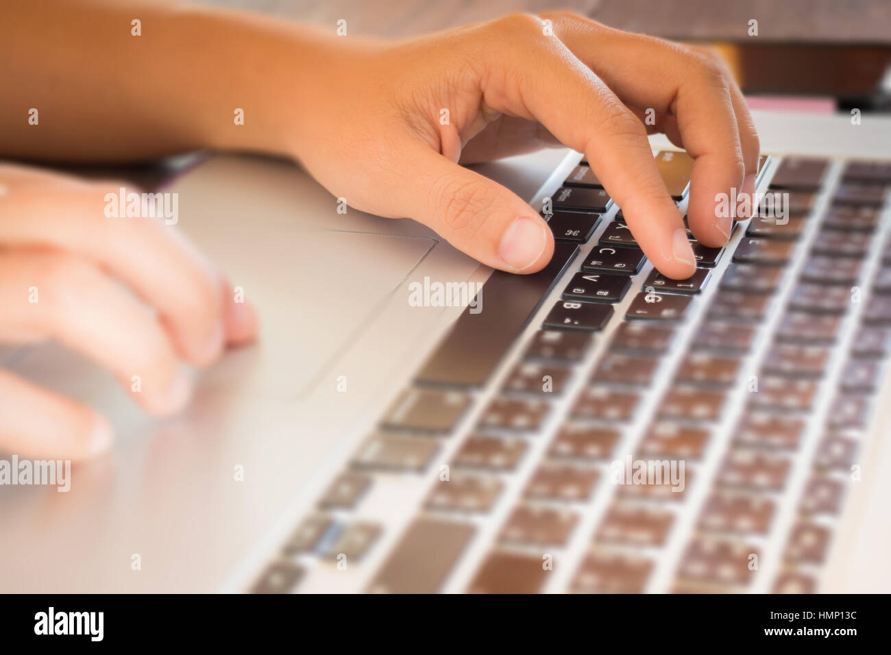 Typing on keyboard laptop at work table, stock photo Stock Photo - Alamy