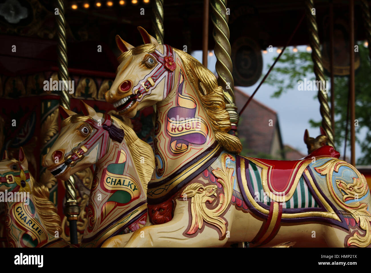 Two old fashioned carousel horses at fairground Stock Photo - Alamy