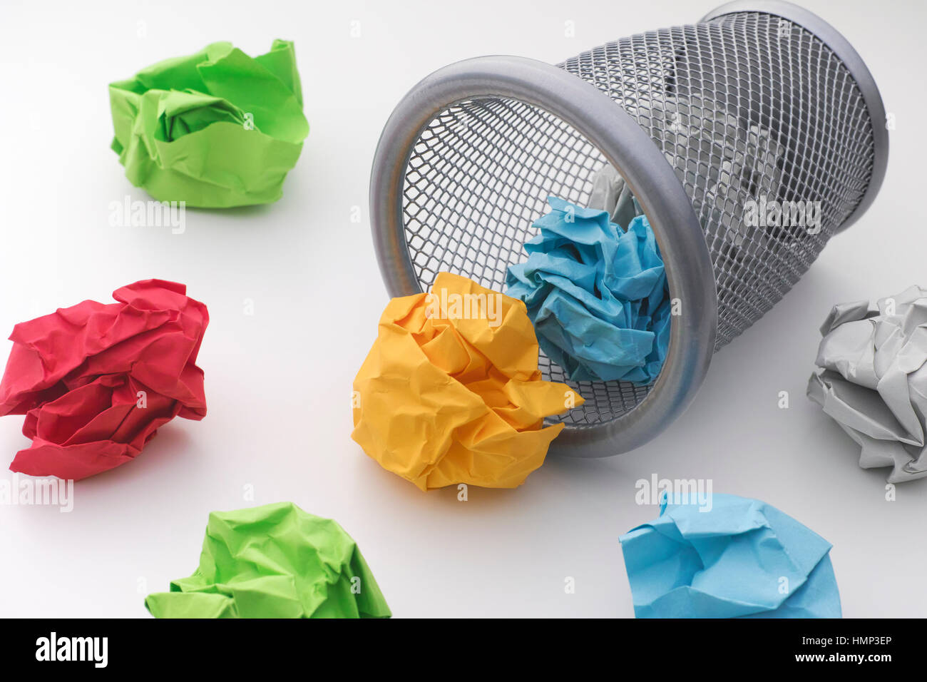 Colorful paper balls rolling out of trash can. Idea Concept Stock Photo ...