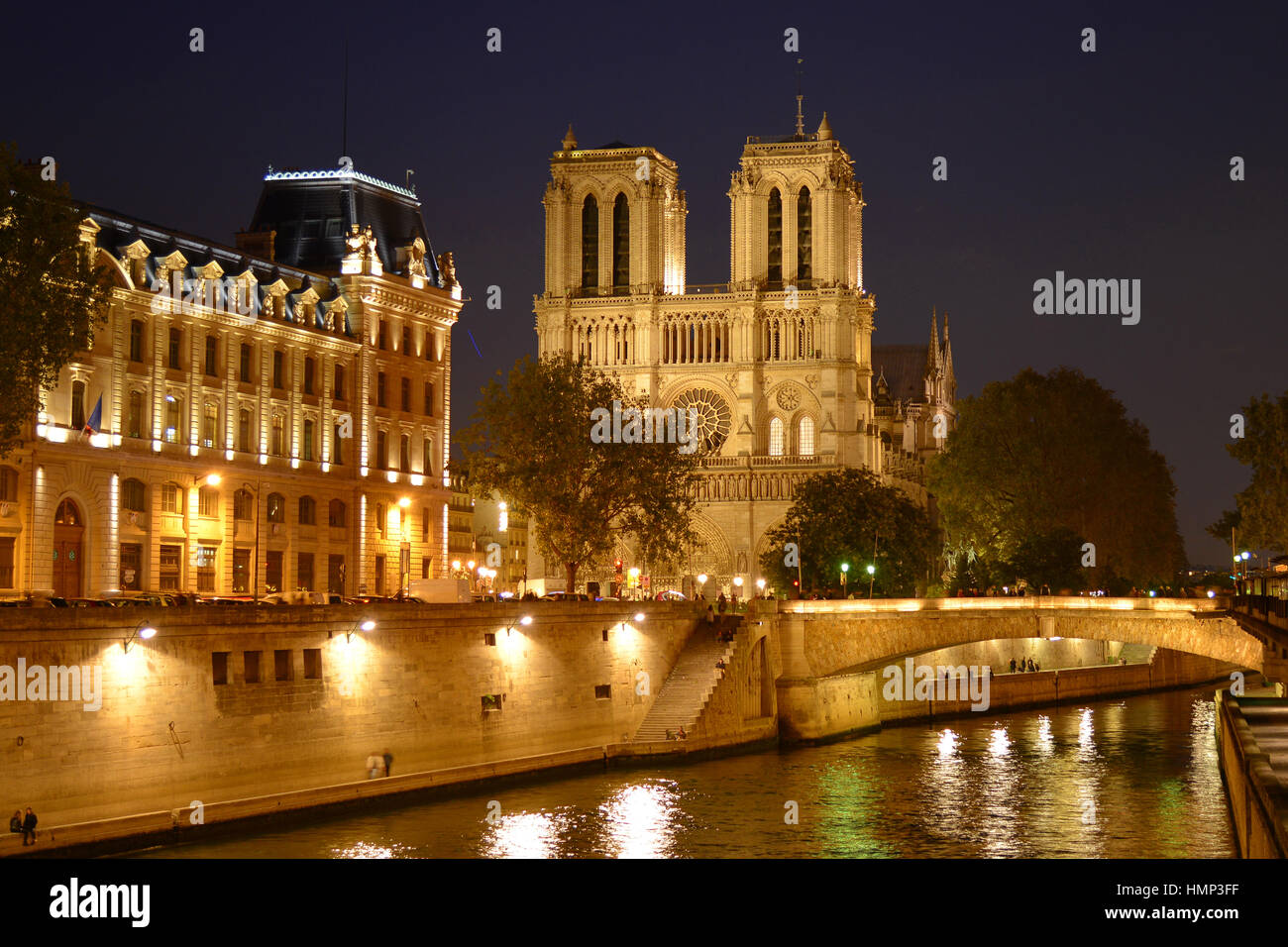 Famous gothic Dome Notre Dame in Paris at night Stock Photo - Alamy