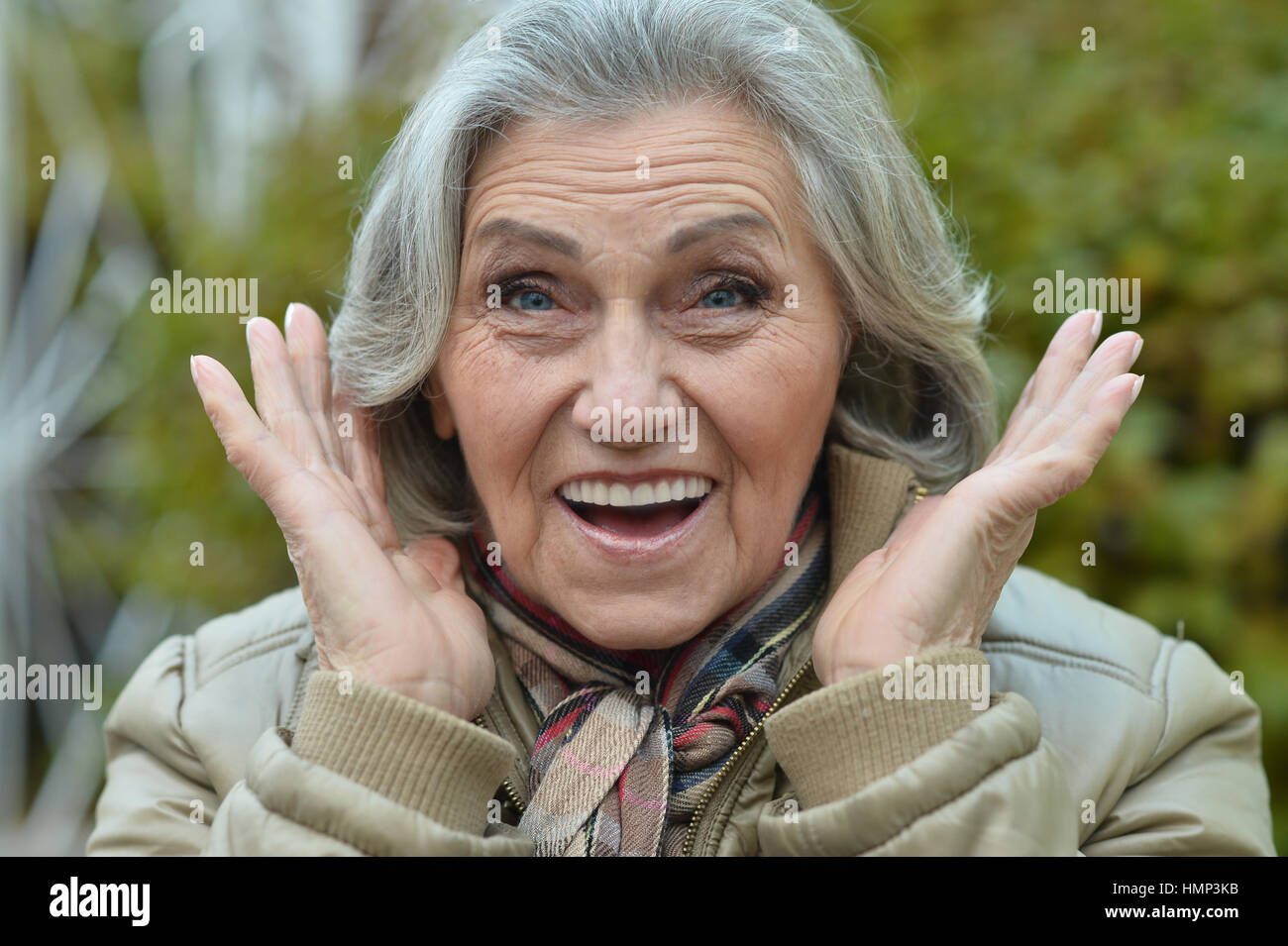 Surprise senior woman in autumn Stock Photo - Alamy