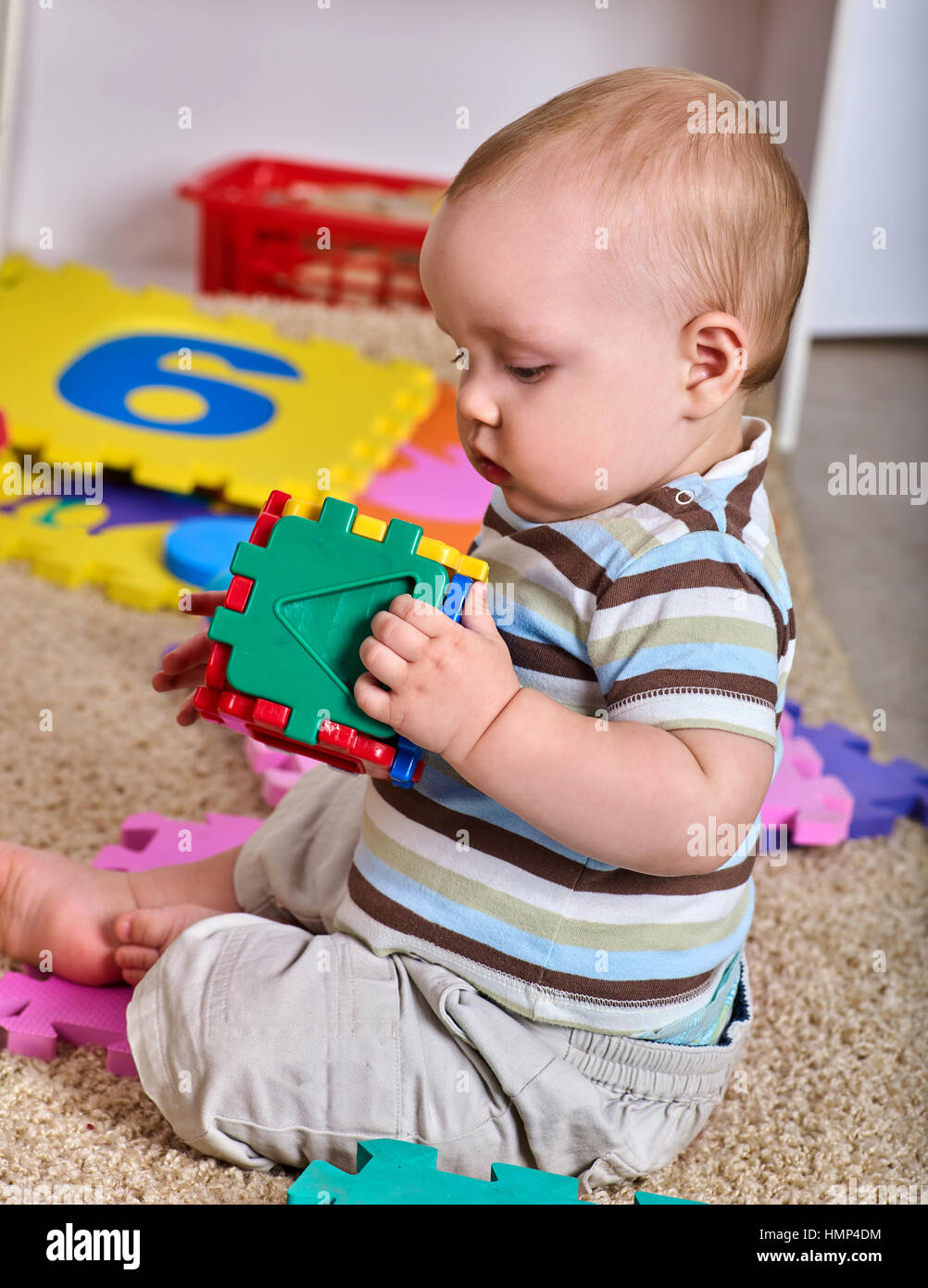 Baby making puzzle. Child jigsaw develops children Stock Photo - Alamy