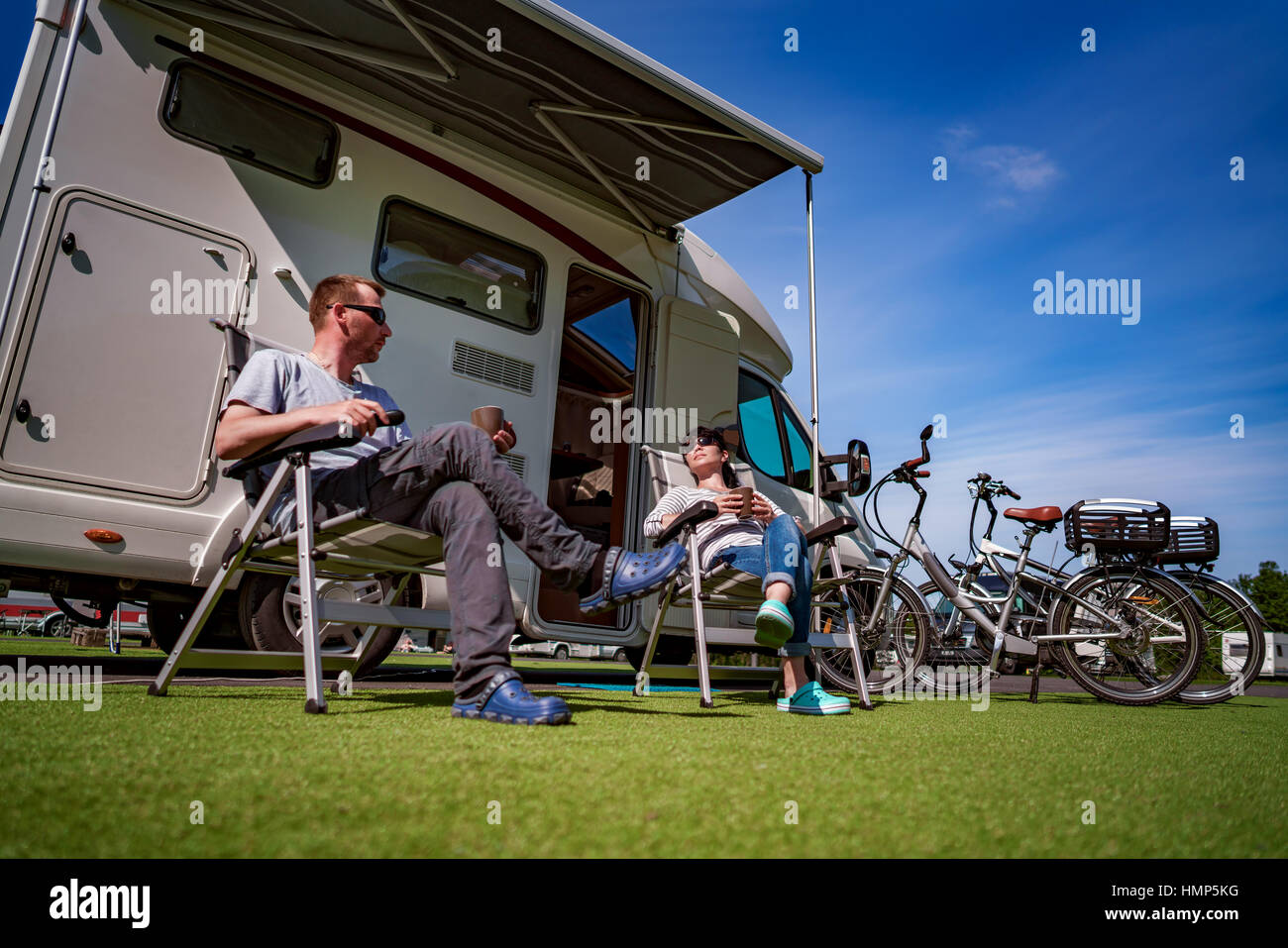 Couple on holiday at a campsite. Caravan car Vacation. Family vacation ...