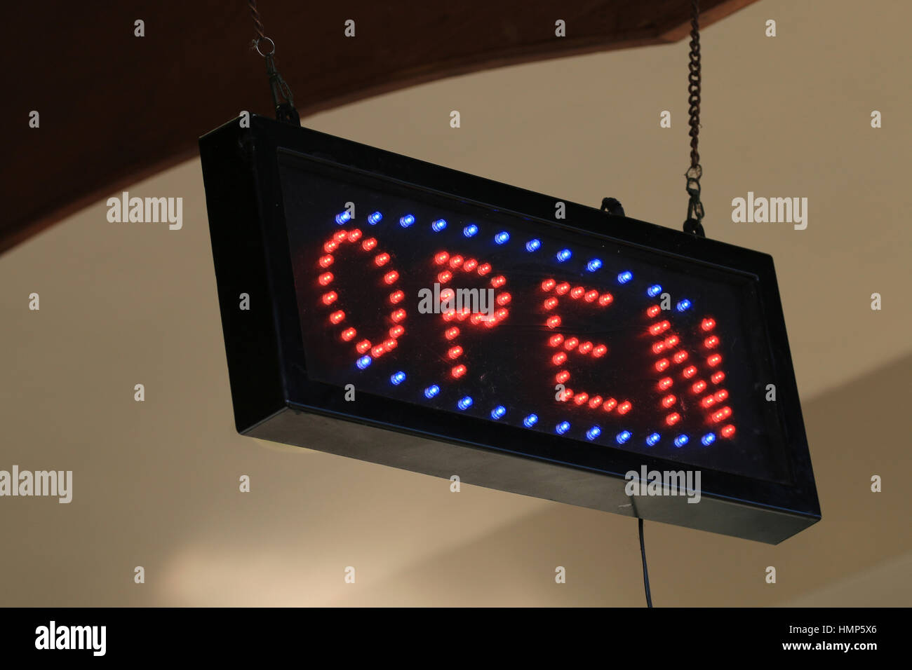 OPEN sign in red neon lights with blue Stock Photo - Alamy