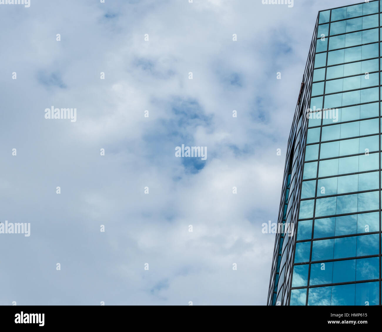 Modern glass building reflecting clouds and sky Stock Photo - Alamy