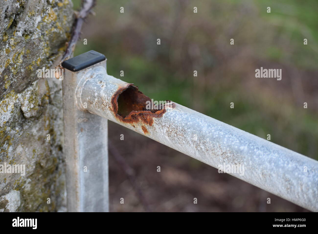 Rusted metal pole on a gate Stock Photo - Alamy