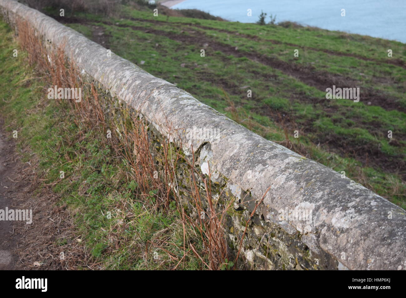 Side view of a stone wall ledge Stock Photo - Alamy