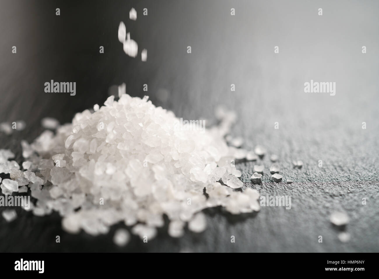 coarse sea salt on slate background Stock Photo - Alamy