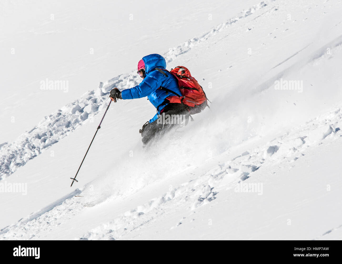 Retired female back country skier in fresh powder; Esplanade Range ...