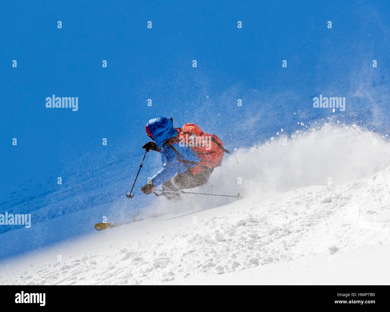 Retired female back country skier in fresh powder; Esplanade Range ...