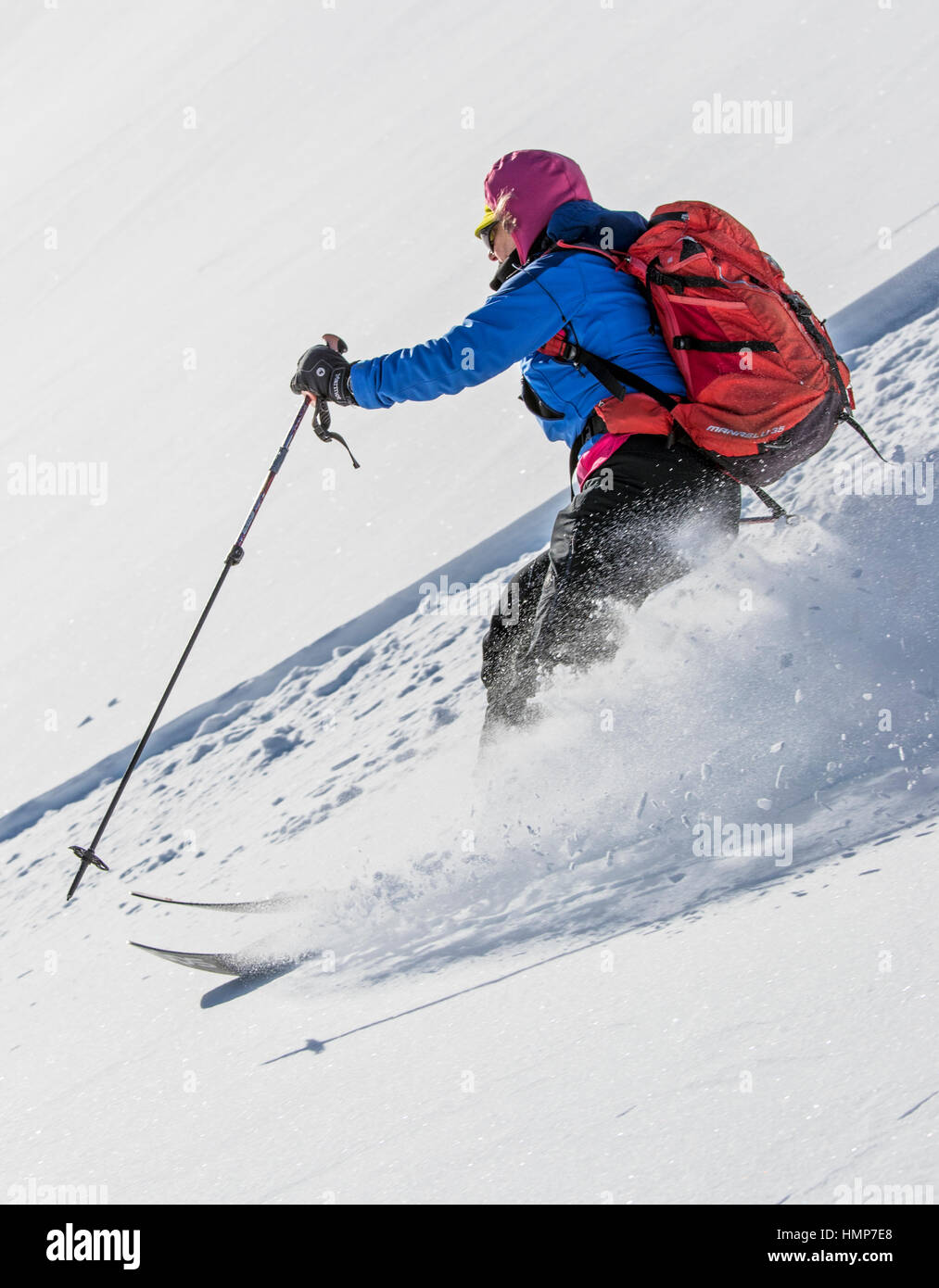 Retired female back country skier in fresh powder; Esplanade Range ...