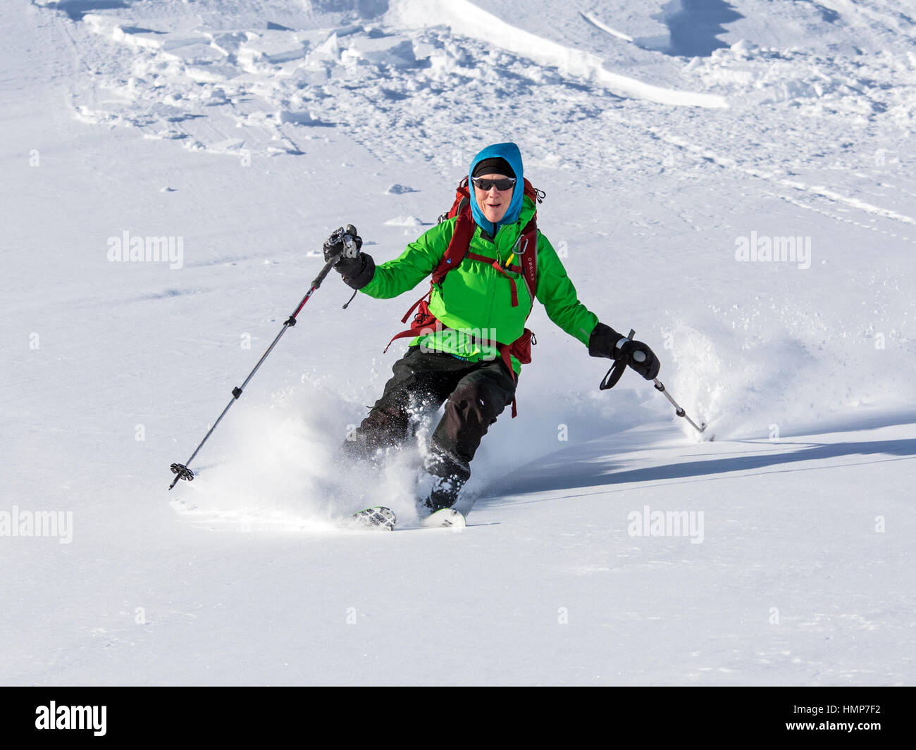 Female back country skier in fresh powder; Esplanade Range; Selkirk ...