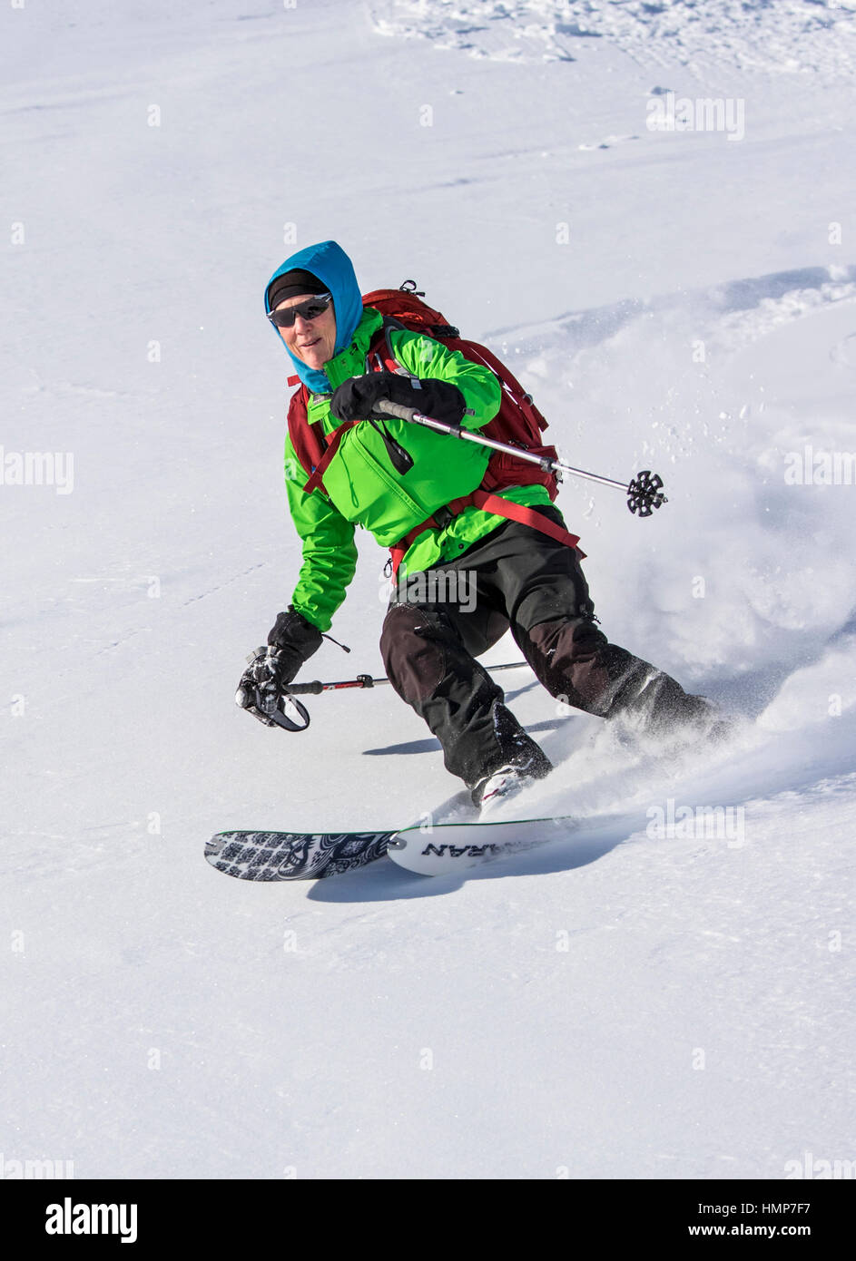 Female back country skier in fresh powder; Esplanade Range; Selkirk ...