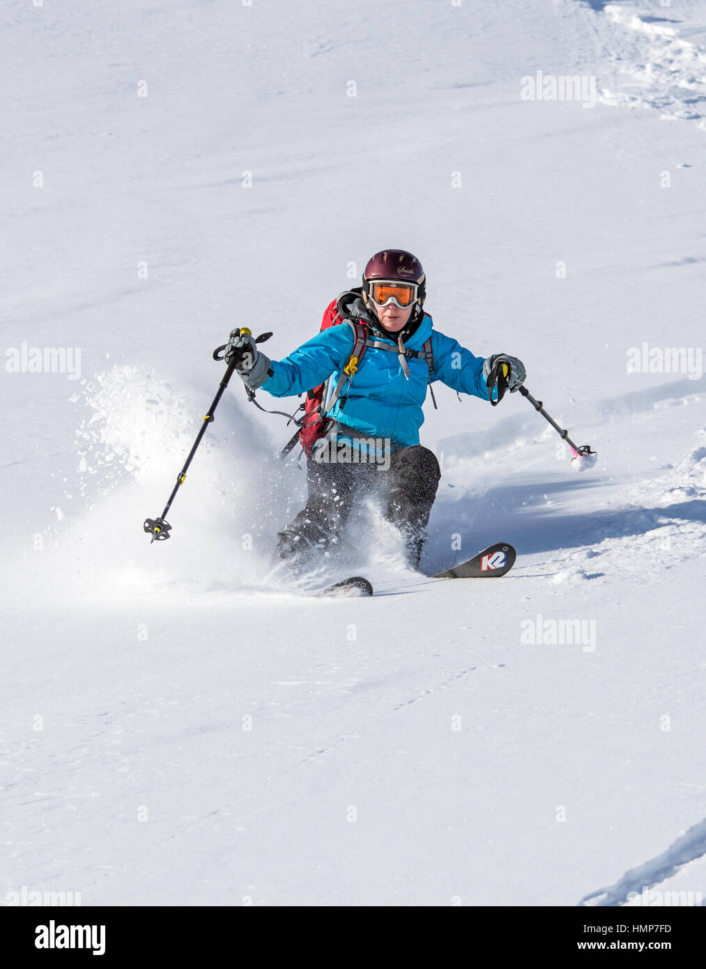 Female back country skier in fresh powder; Esplanade Range; Selkirk ...