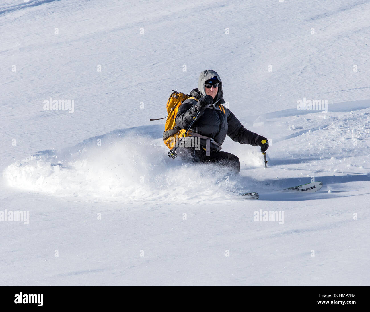 Senior male back country skier in fresh powder; Esplanade Range ...