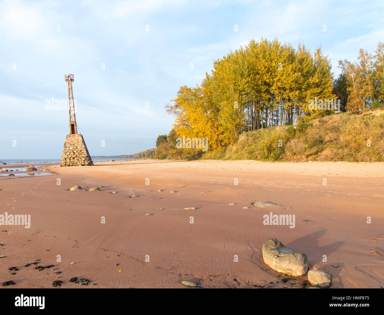 Shoreline of Baltic sea beach with rocks and sand dunes under clouds ...