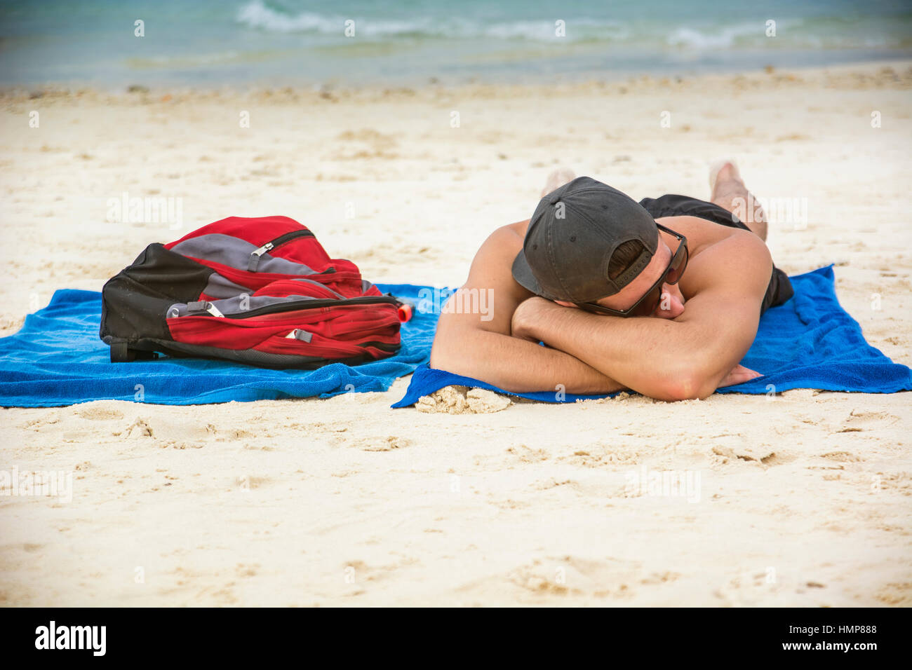 Man in sunglasses sunbathing Stock Photo - Alamy