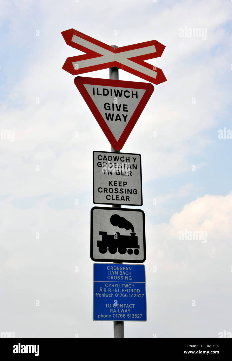 Railway crossing warning sign in English and Welsh, Porthmadog, Wales ...