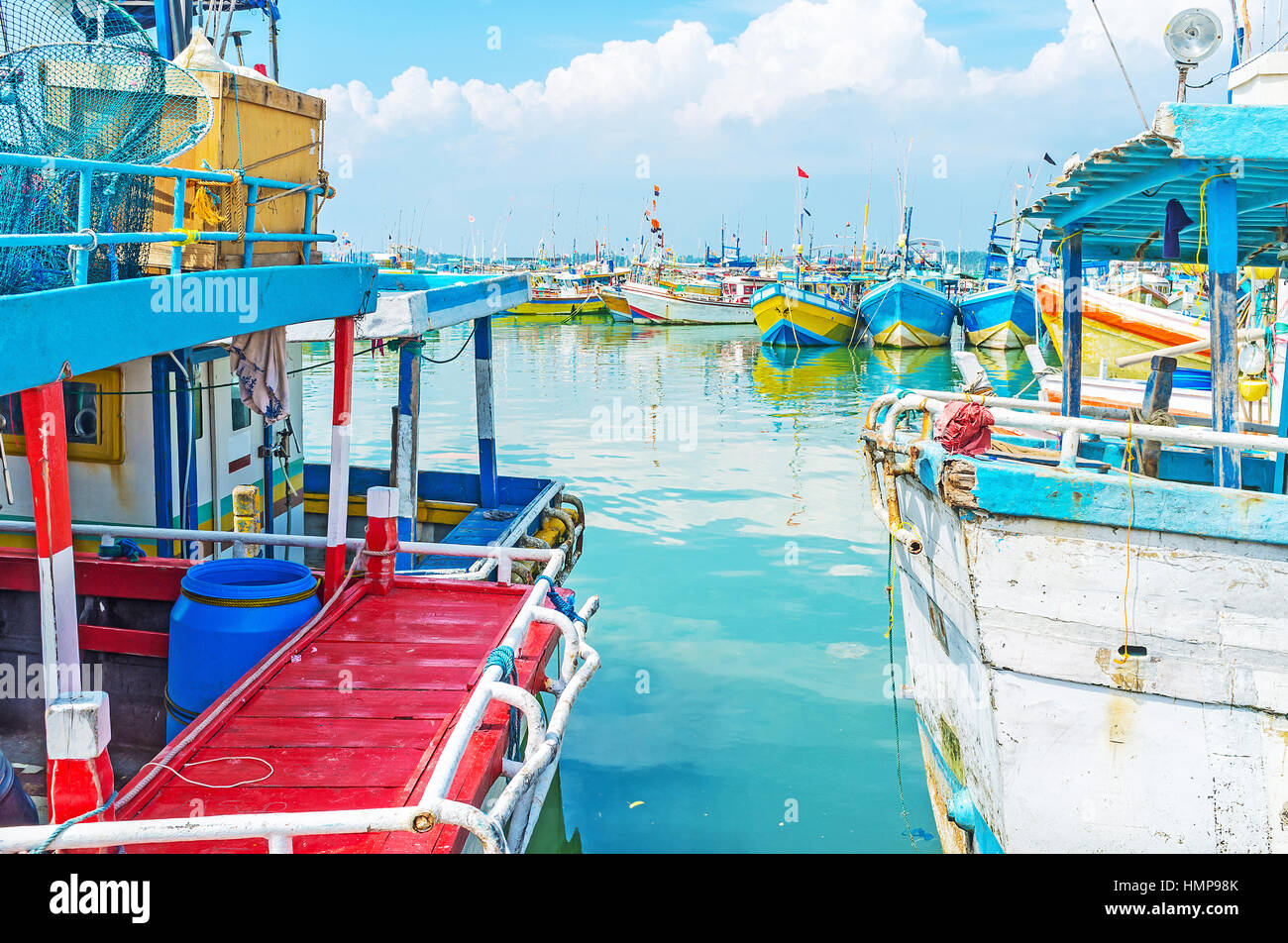 The view on fisheries harbor through the space between two colorful ...