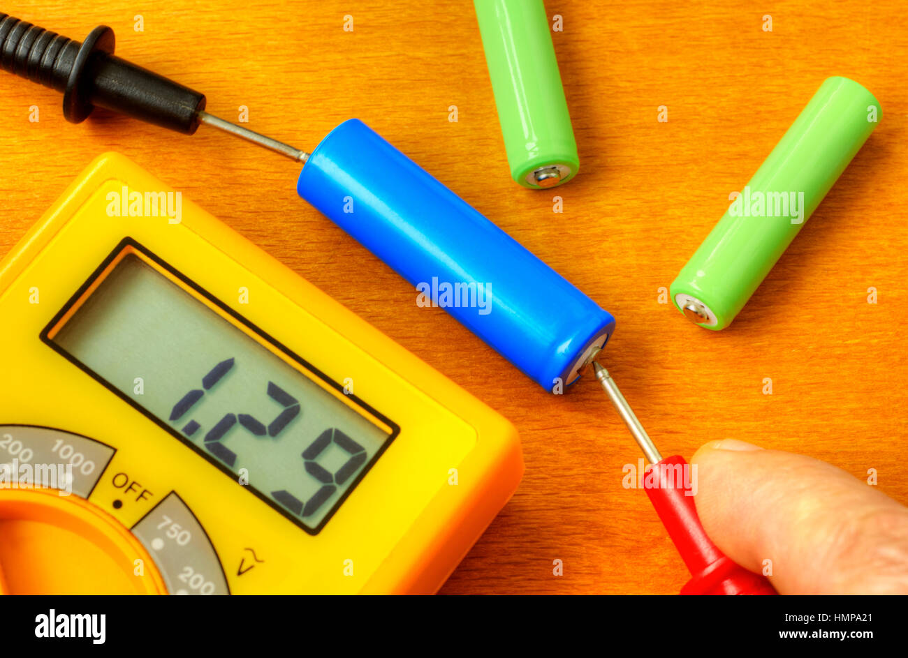 Measuring with digital multimeter of rechargeable battery Stock Photo ...