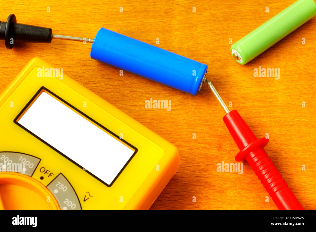 Measuring with digital multimeter of rechargeable battery Stock Photo ...