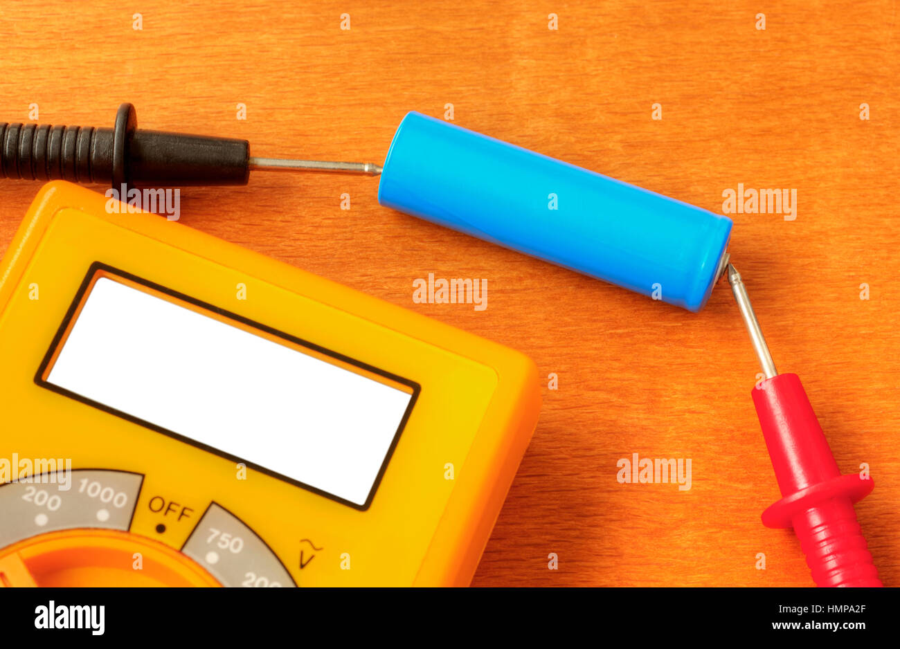 Measuring with digital multimeter of rechargeable battery Stock Photo ...