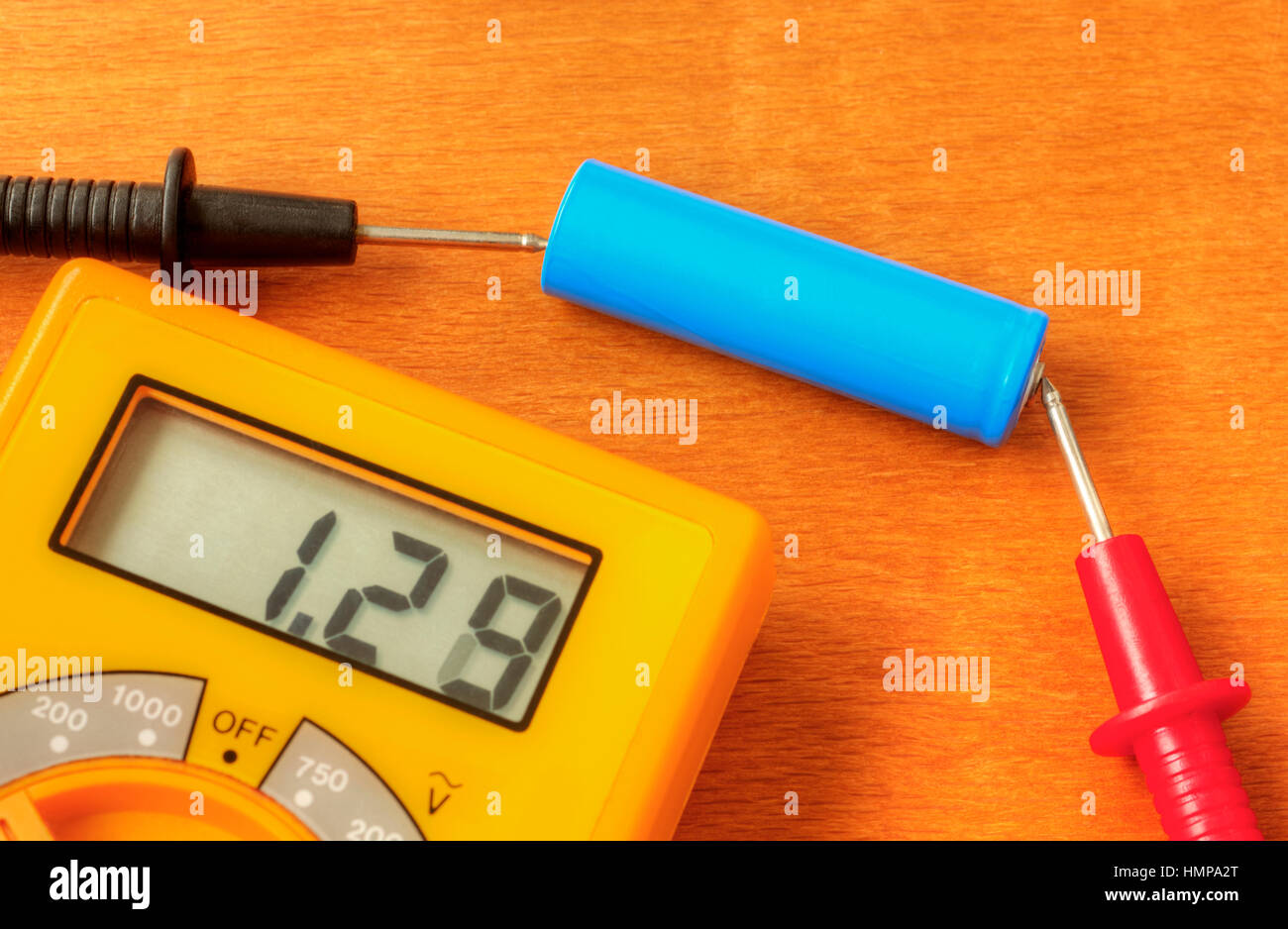 Measuring With Digital Multimeter Of Rechargeable Battery Stock Photo measuring-with-digital-multimeter-of-rechargeable-battery-stock-photo