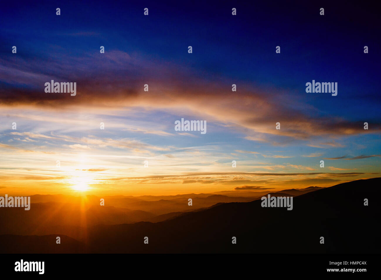 blue color of mountains during sunset Stock Photo - Alamy