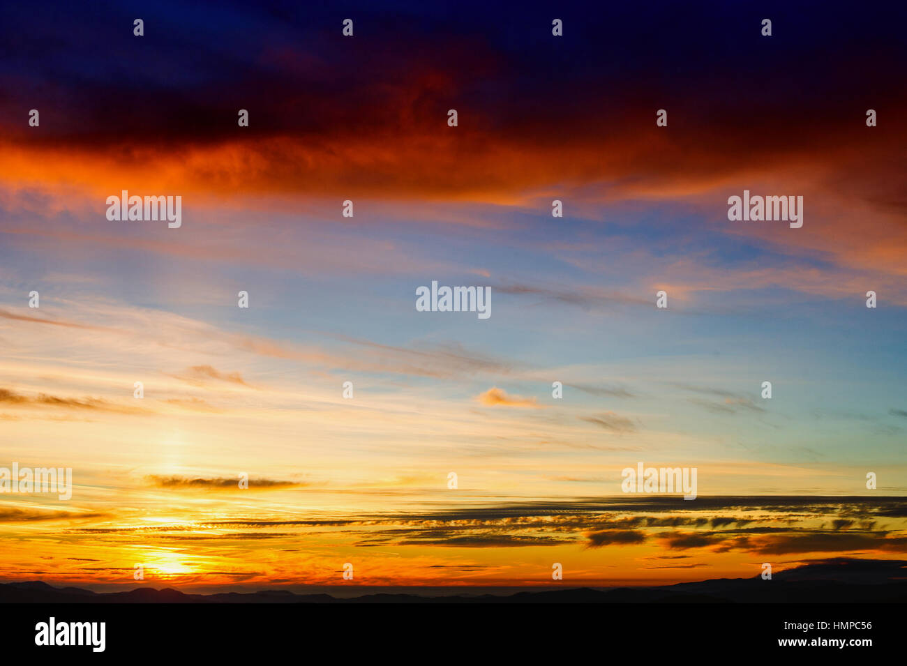 Colorful sunset over the mountain hills Stock Photo - Alamy