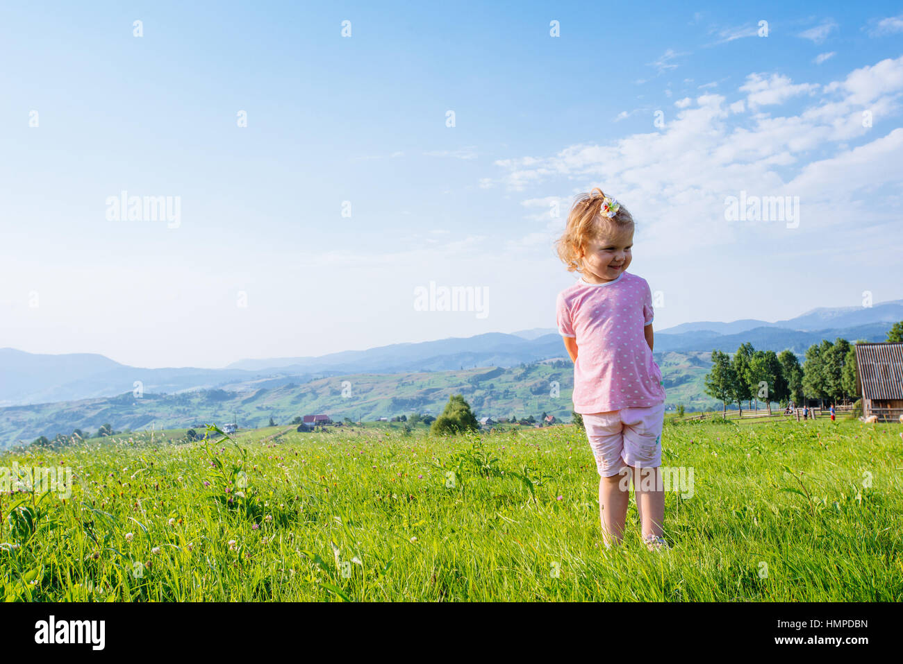 Little toddler girl running in a beautiful field Stock Photo - Alamy