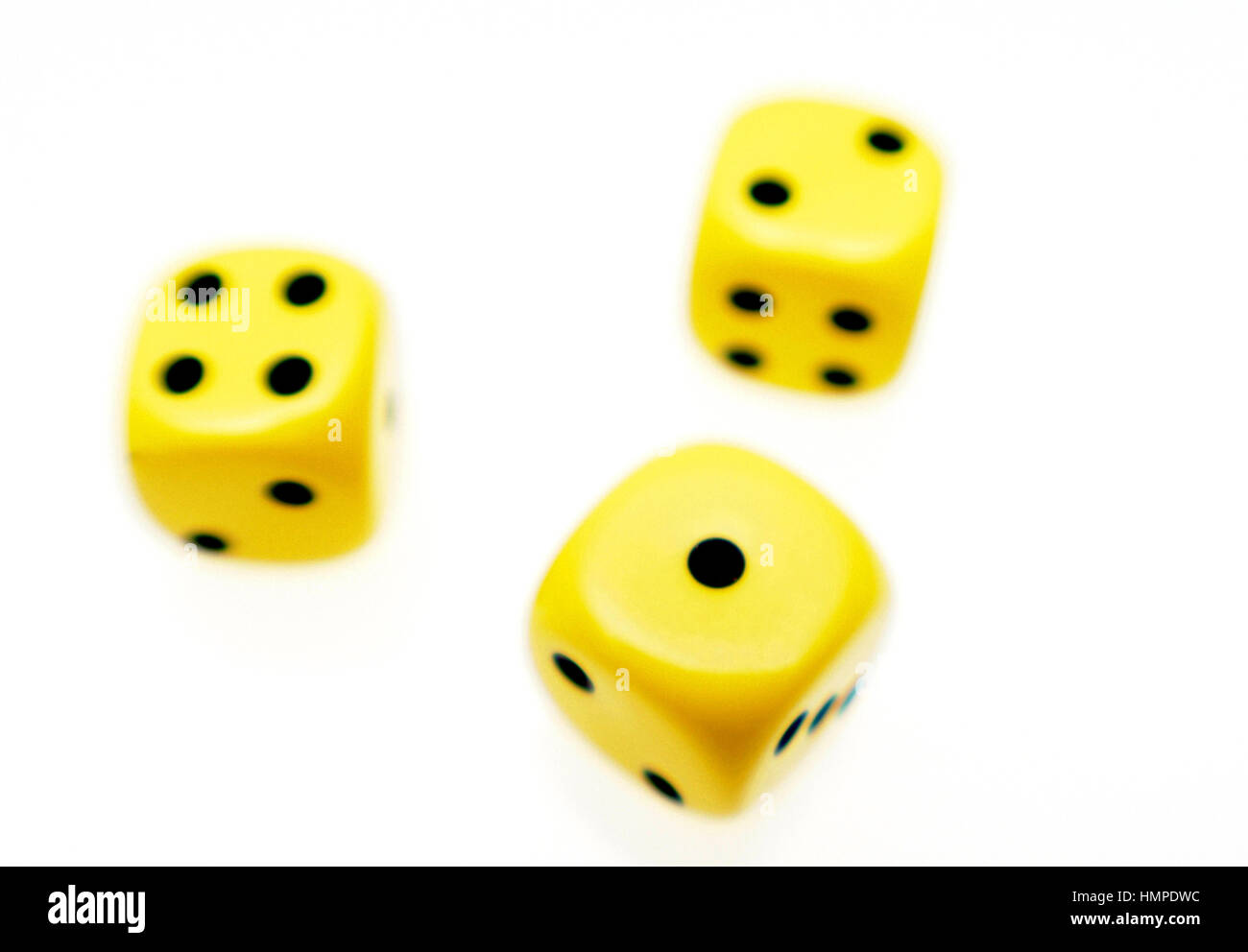 Three yellow dice Stock Photo - Alamy