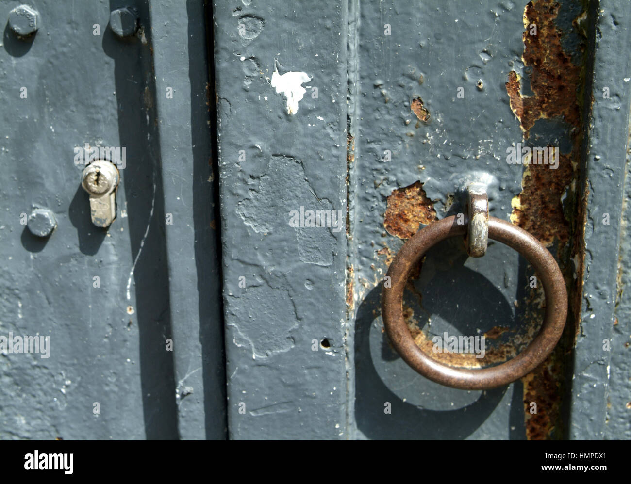 Rusty iron door with knocker Stock Photo - Alamy
