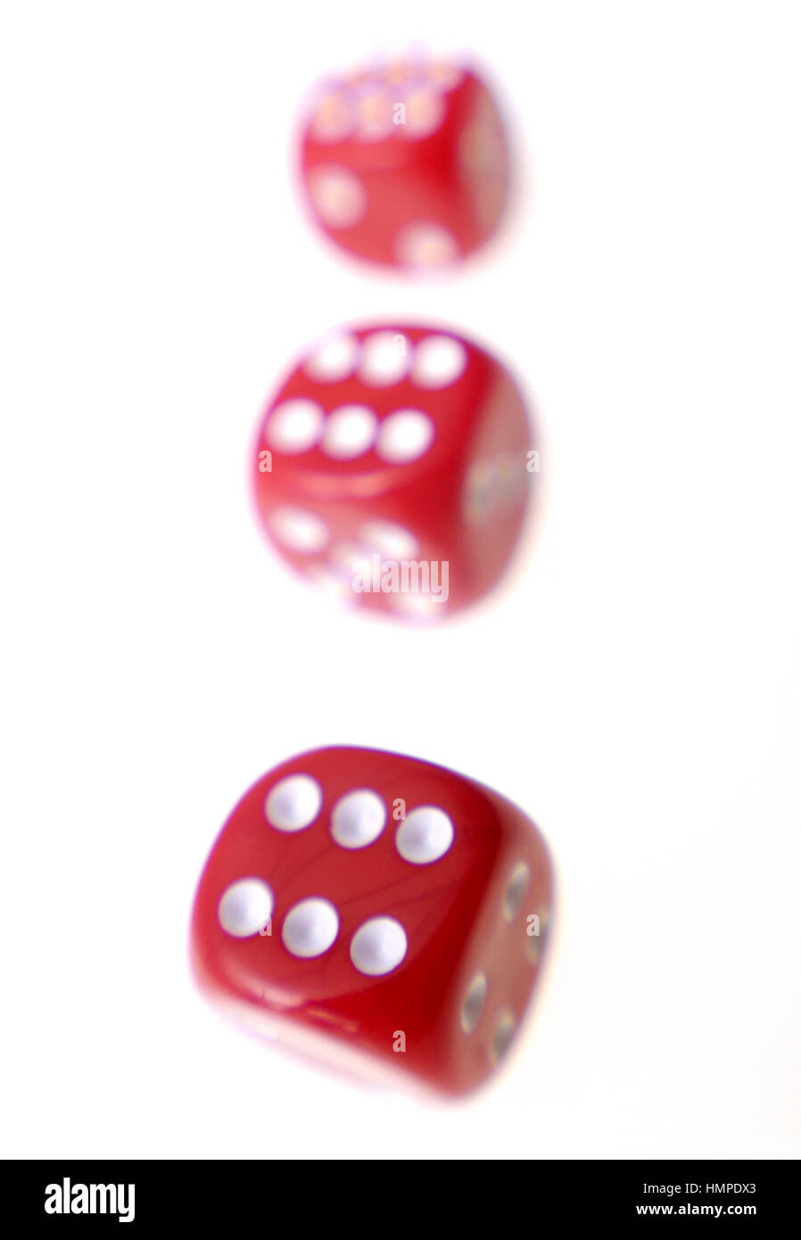 Three red dice Stock Photo - Alamy