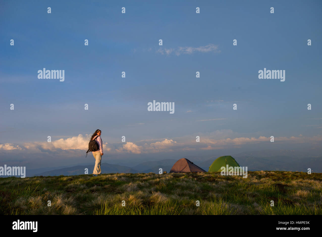 Woman wild camping Stock Photo - Alamy