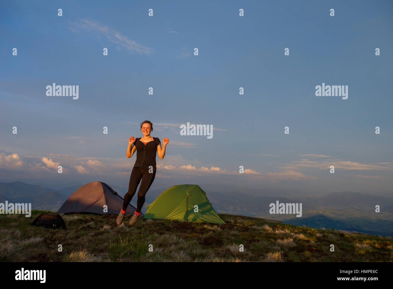 Woman wild camping Stock Photo - Alamy