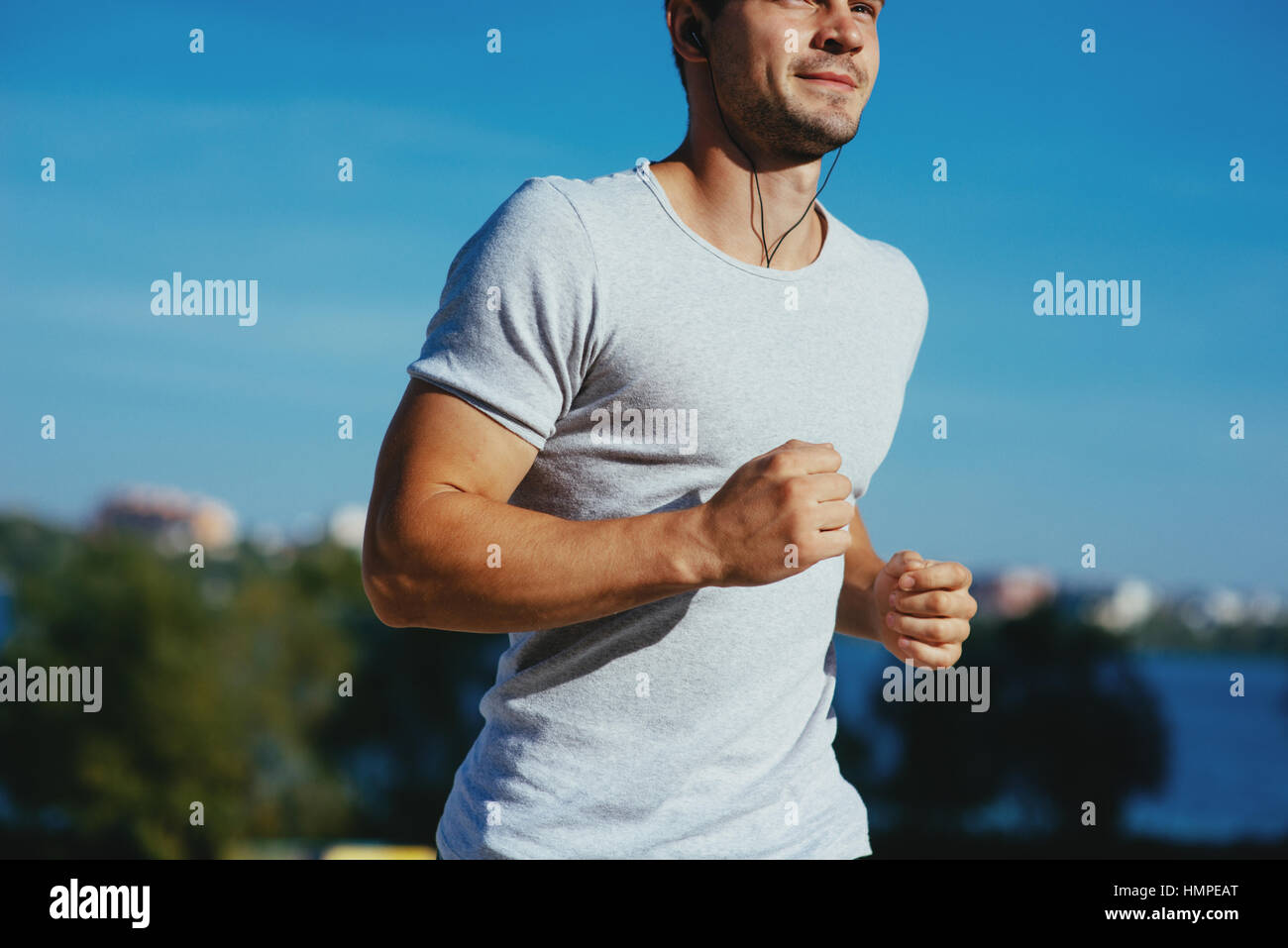 Attractive strong athlete running Stock Photo - Alamy