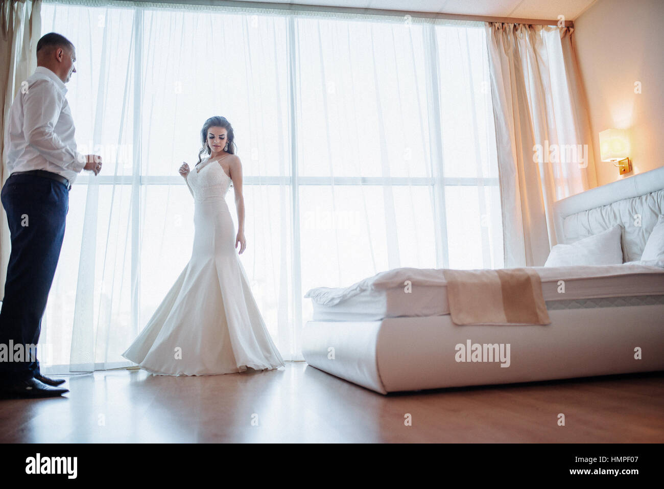 Wedding couple in hotel room Stock Photo - Alamy