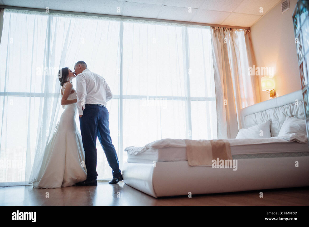 Wedding couple in hotel room Stock Photo - Alamy