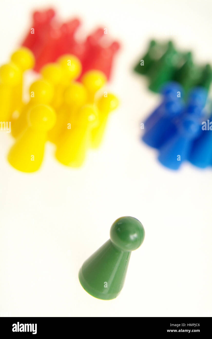 Coloured pawns in a game Stock Photo - Alamy