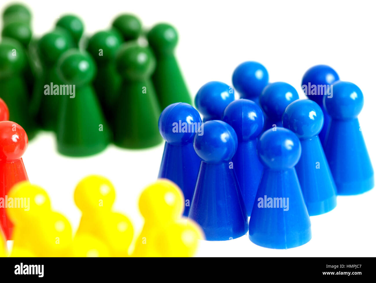 Coloured pawns in a game Stock Photo - Alamy