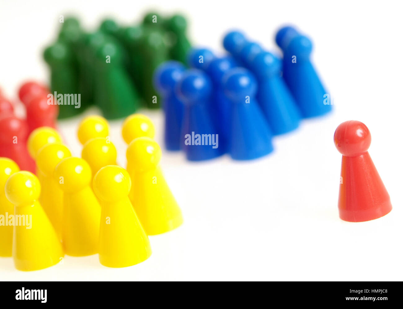 Coloured pawns in a game Stock Photo - Alamy