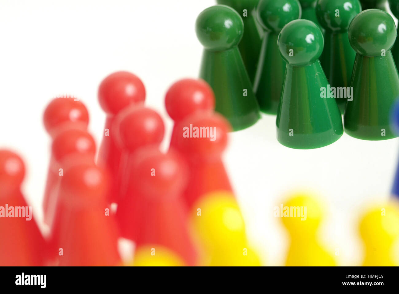 Coloured pawns in a game Stock Photo - Alamy
