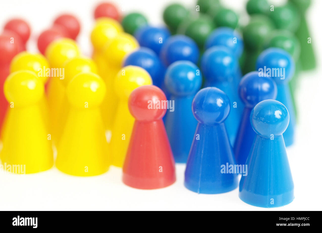 Coloured pawns in a game Stock Photo - Alamy