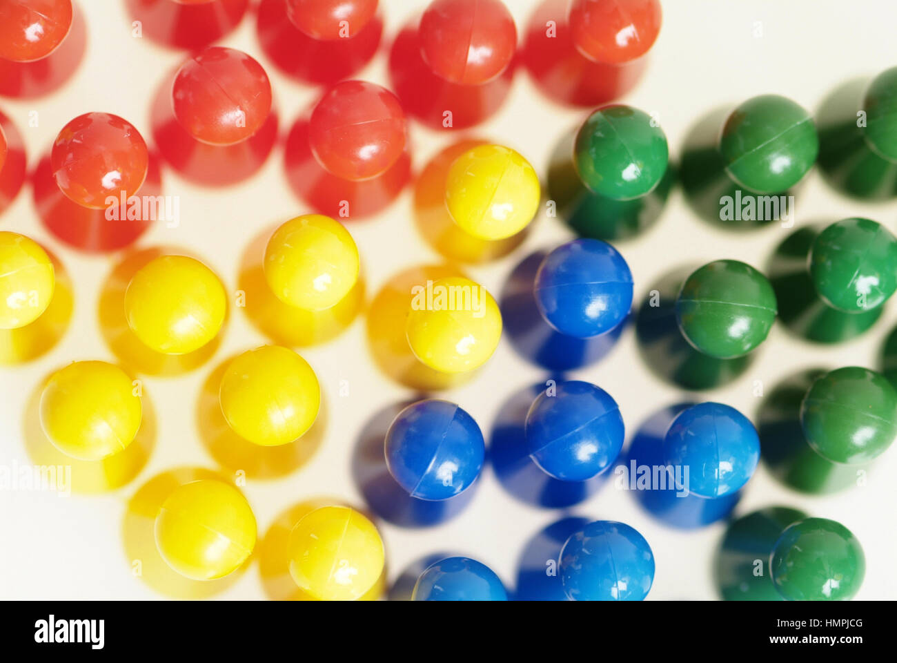 Coloured pawns in a game Stock Photo - Alamy
