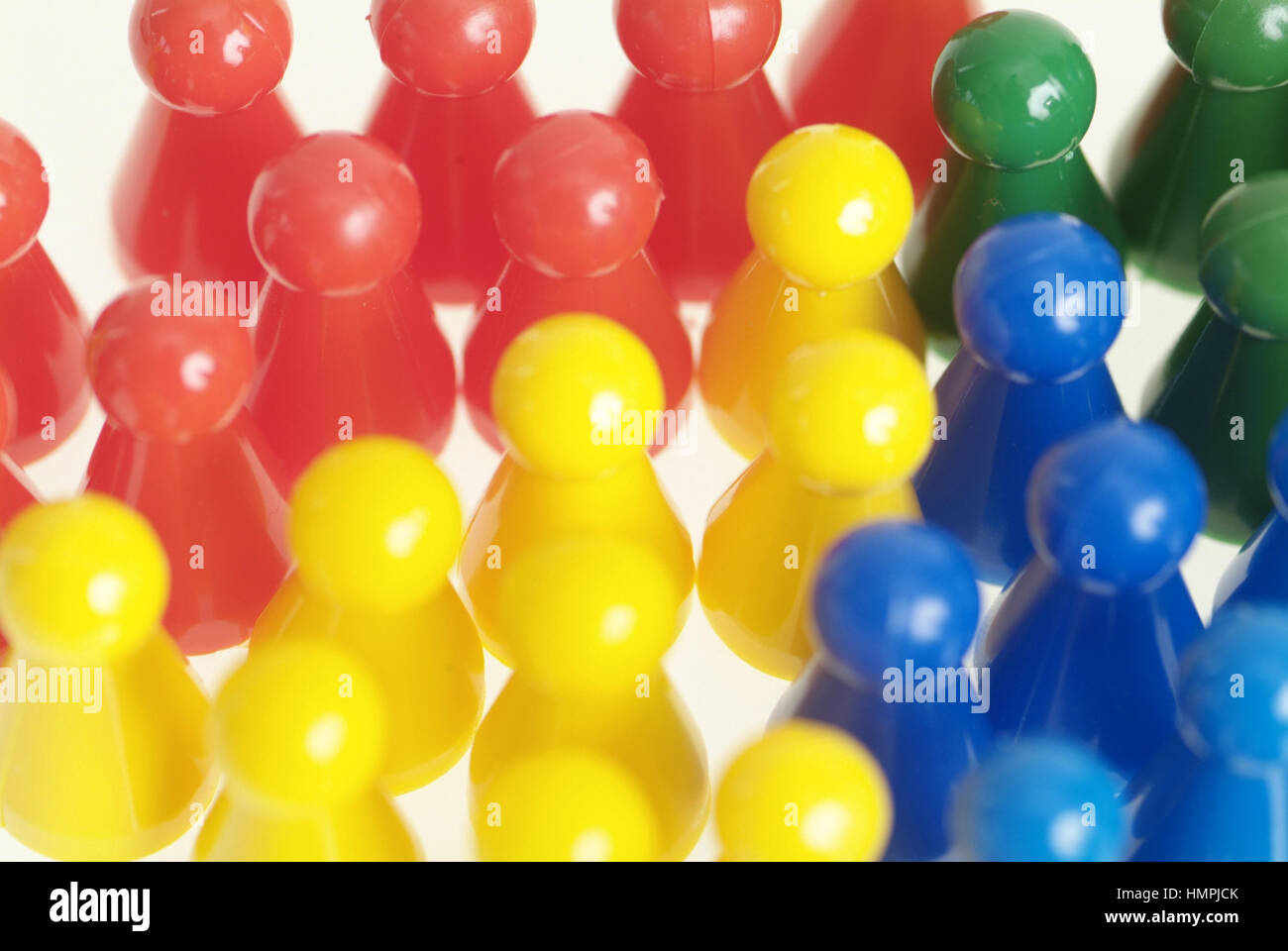 Coloured pawns in a game Stock Photo - Alamy