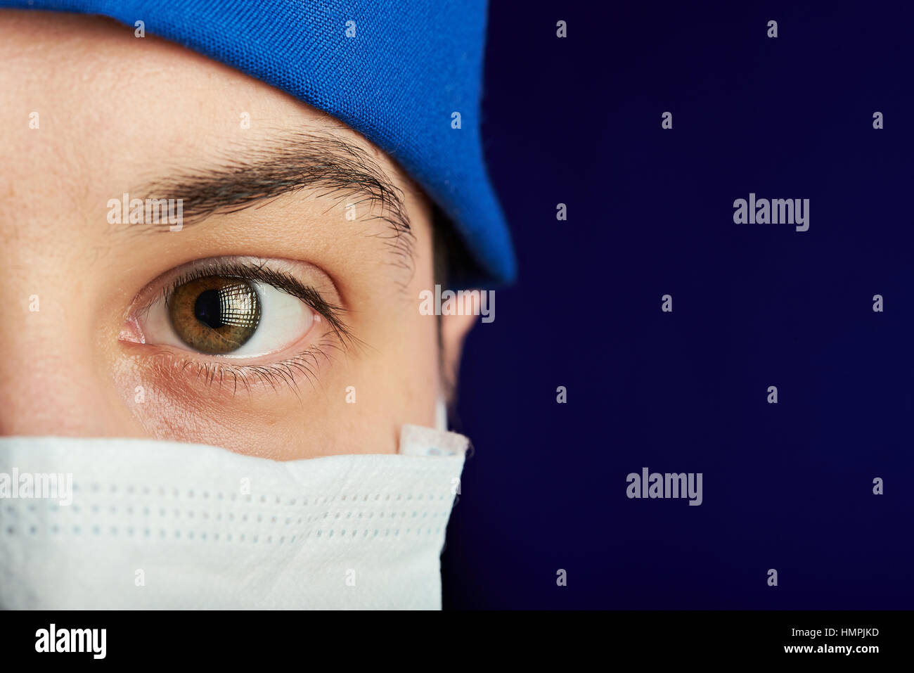 close up nurse eye isolated on purple background Stock Photo - Alamy