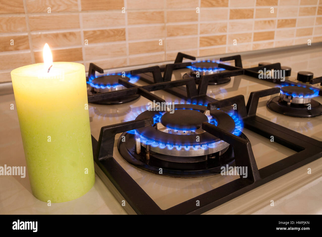 Closeup shot of blue fire from domestic kitchen stove. Gas cooker with ...