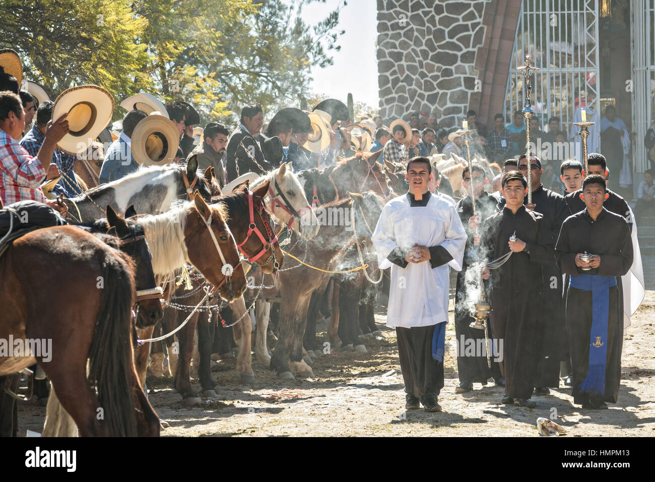 Catholic priests begin the procession at the start of mass for ...
