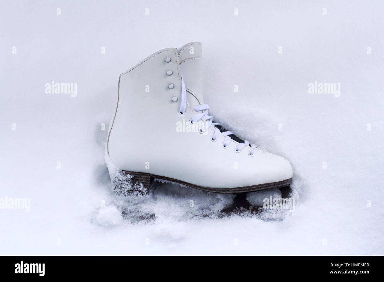 front view of white classical leather iceskate shoe with the metallic ...